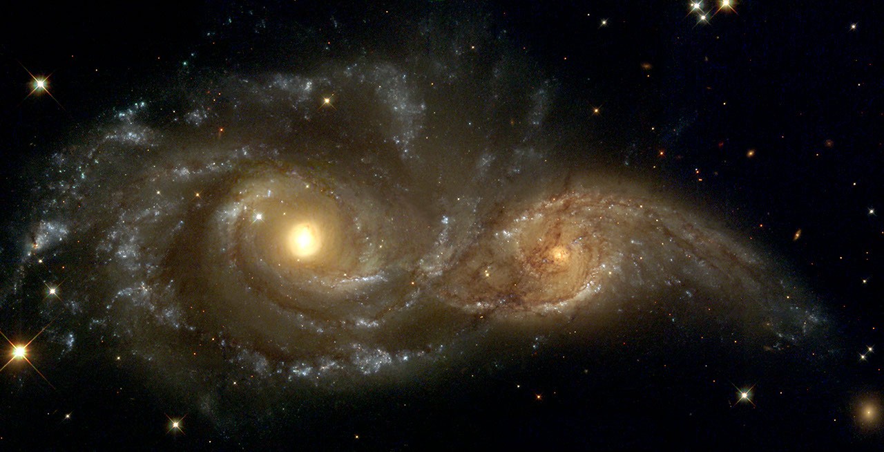 A Grazing Encounter Between Two Spiral Galaxies (NGC 2207 and IC2163 ...