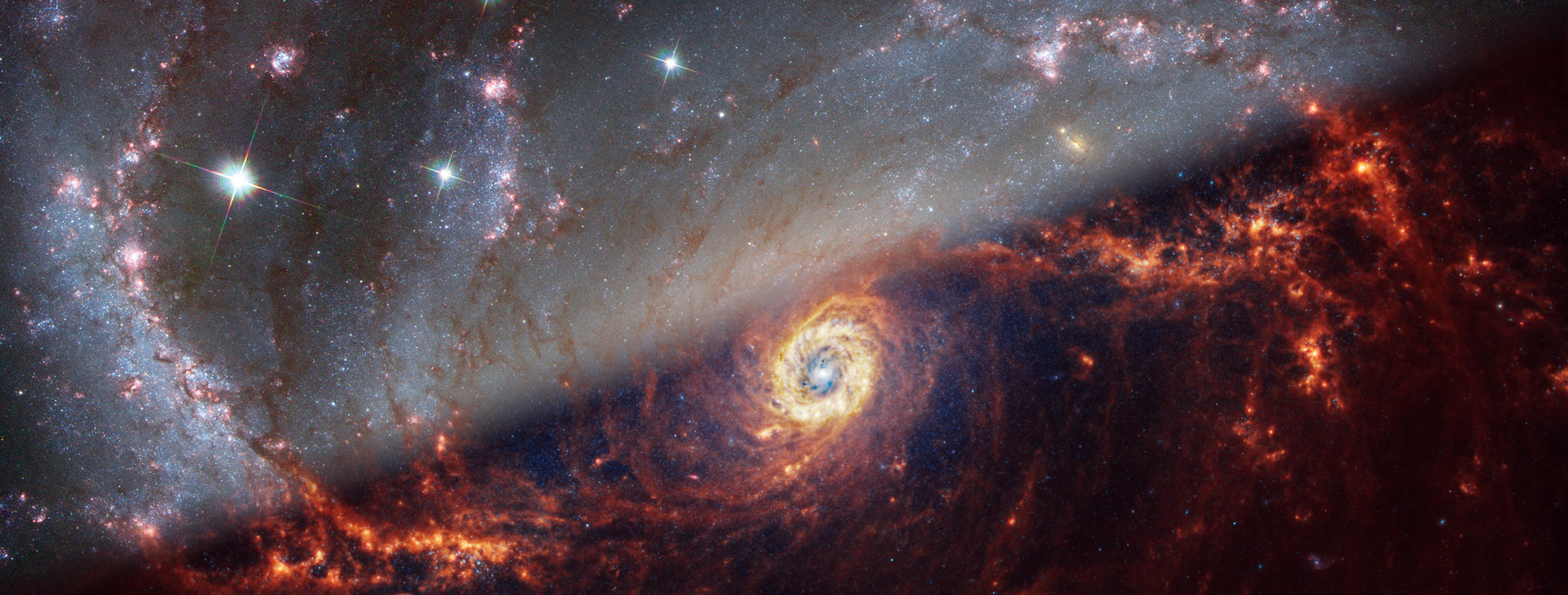 Webb and Hubble's Views of Spiral Galaxy NGC 1672 - NASA Science