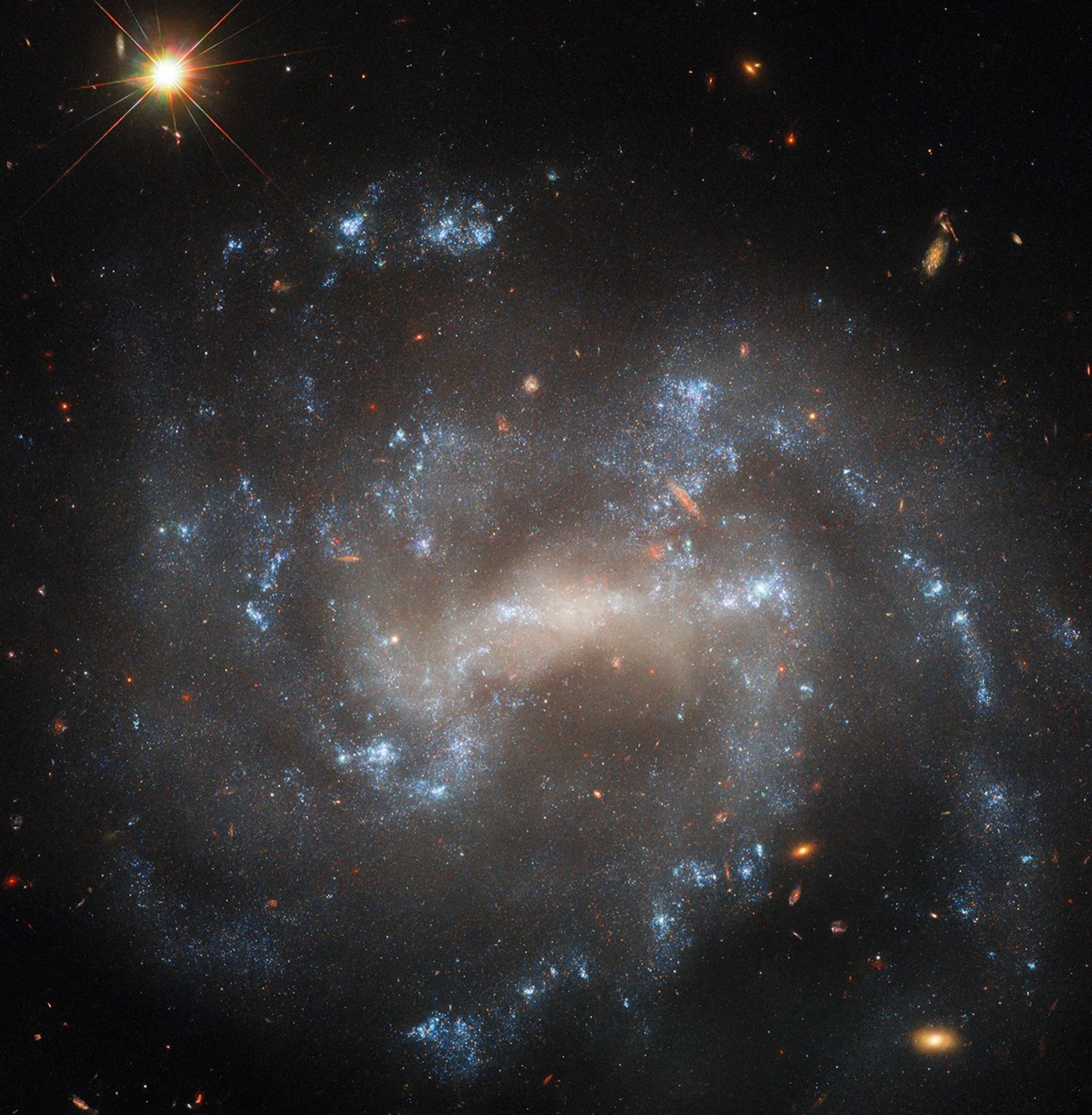 Hubble Spies a Spiral That May Be Hiding an Imposter - NASA Science