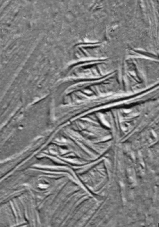 Cracks and Ridges Distorted by Europan Fault Motion - NASA Science
